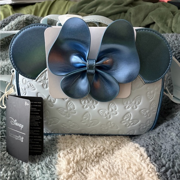Loungefly | Bags | Loungefly Metallic Blue Bow Embossed Mini Bag With ...
